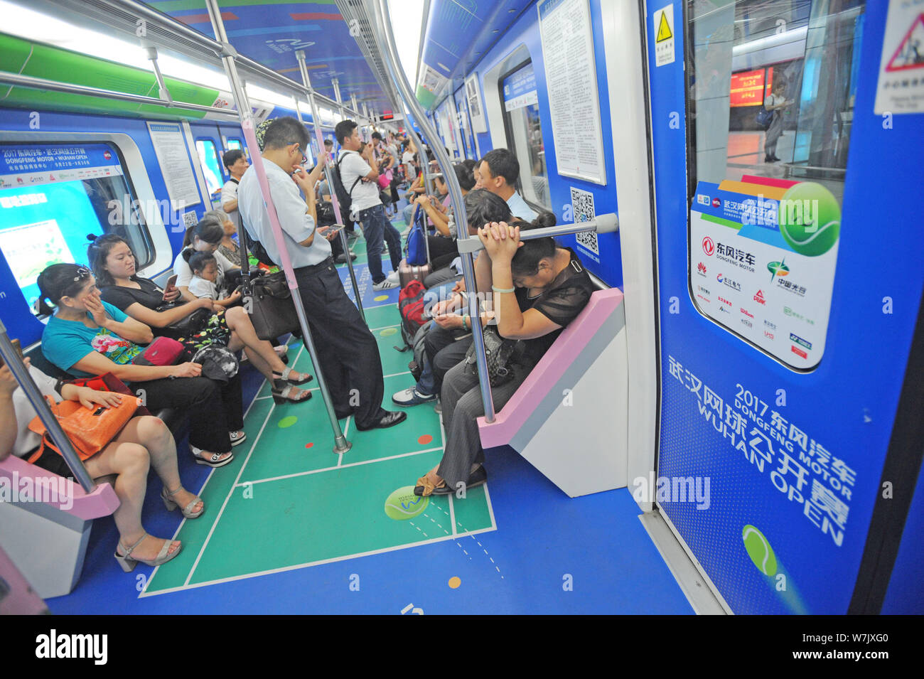 Passengers take a special subway train on the Metro Line 2 for the ...
