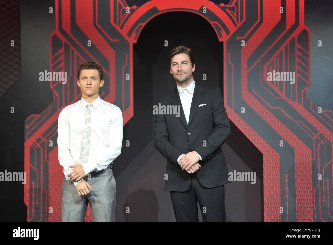 English actor Tom Holland, left, and American film director Jon Watts ...