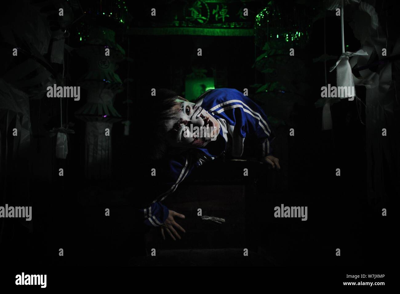 20-year-old Chinese boy Huang Wenwu dressed up as a ghost is seen at a ...