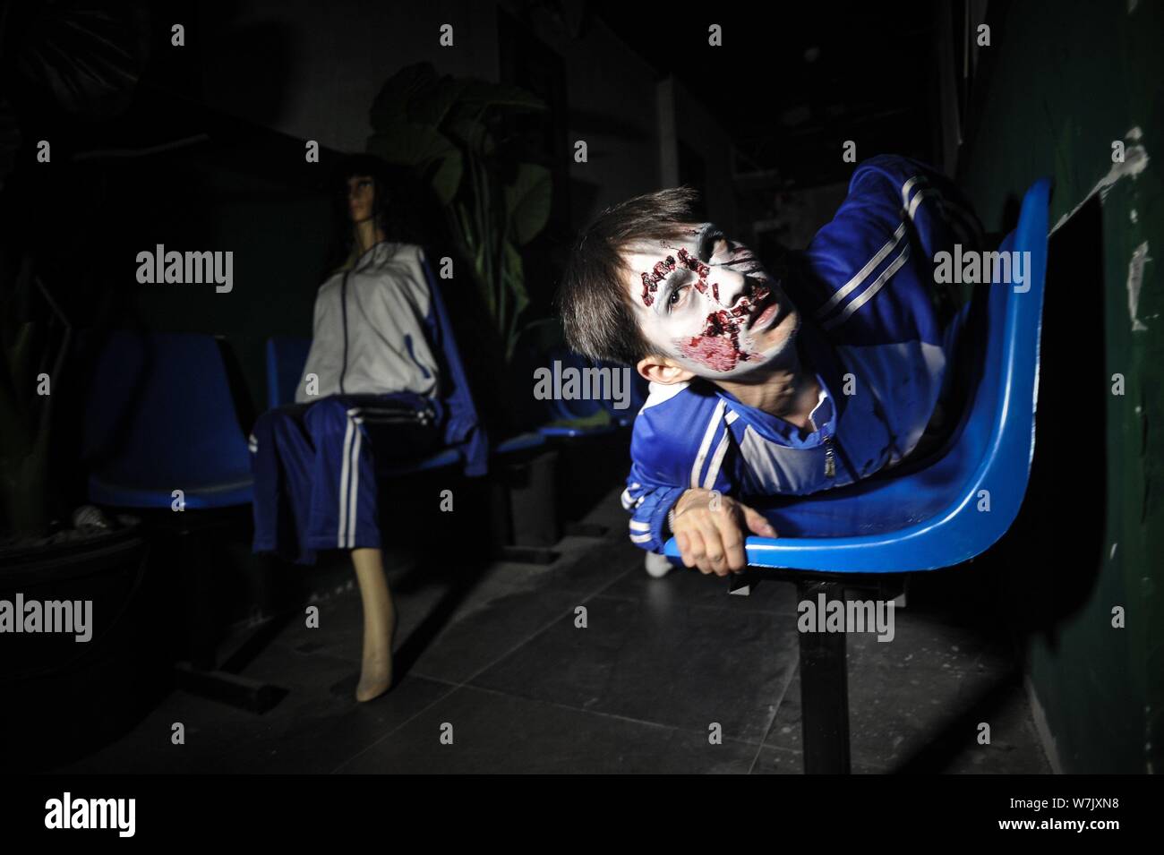20-year-old Chinese boy Huang Wenwu dressed up as a ghost is seen at a ...