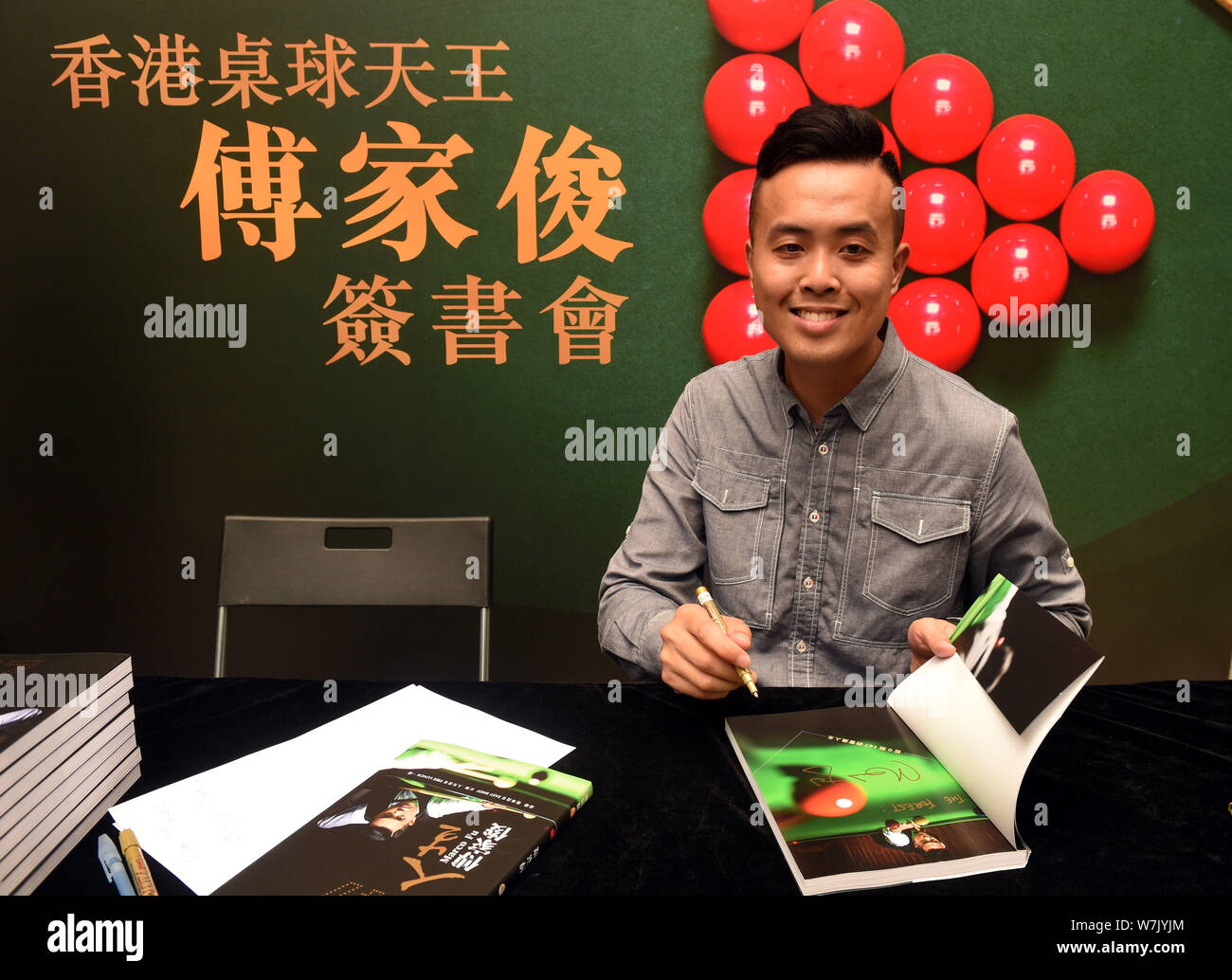 Hong Kong snooker player Marco Fu attends a signing event for his ...
