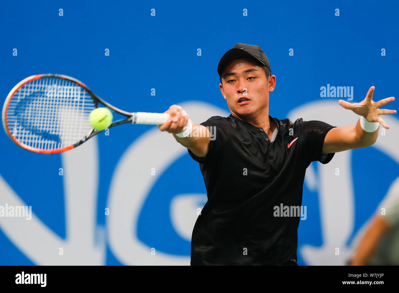 Wu Yibing of China returns a shot to Thiago Monteiro of Brazil in their ...