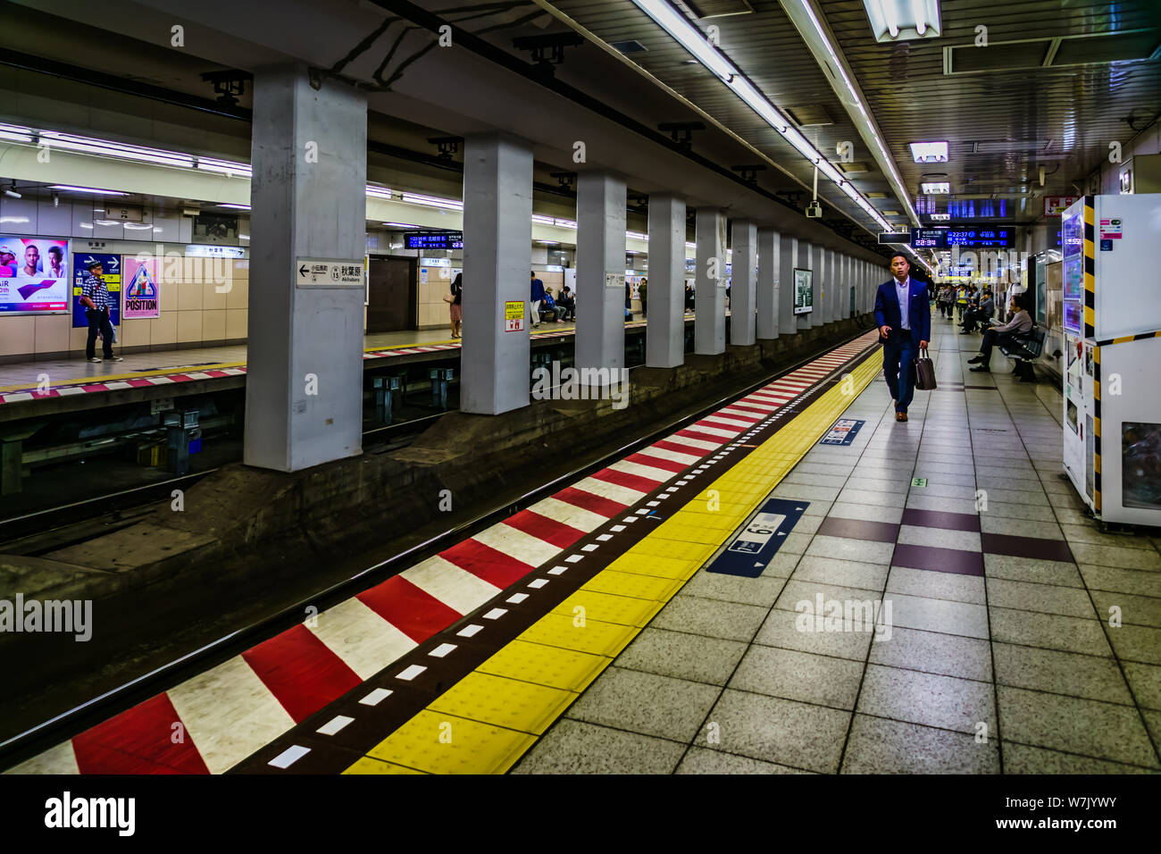 Tokyo, Japan - May 11, 2019: Commuters waiting at subway station for ...