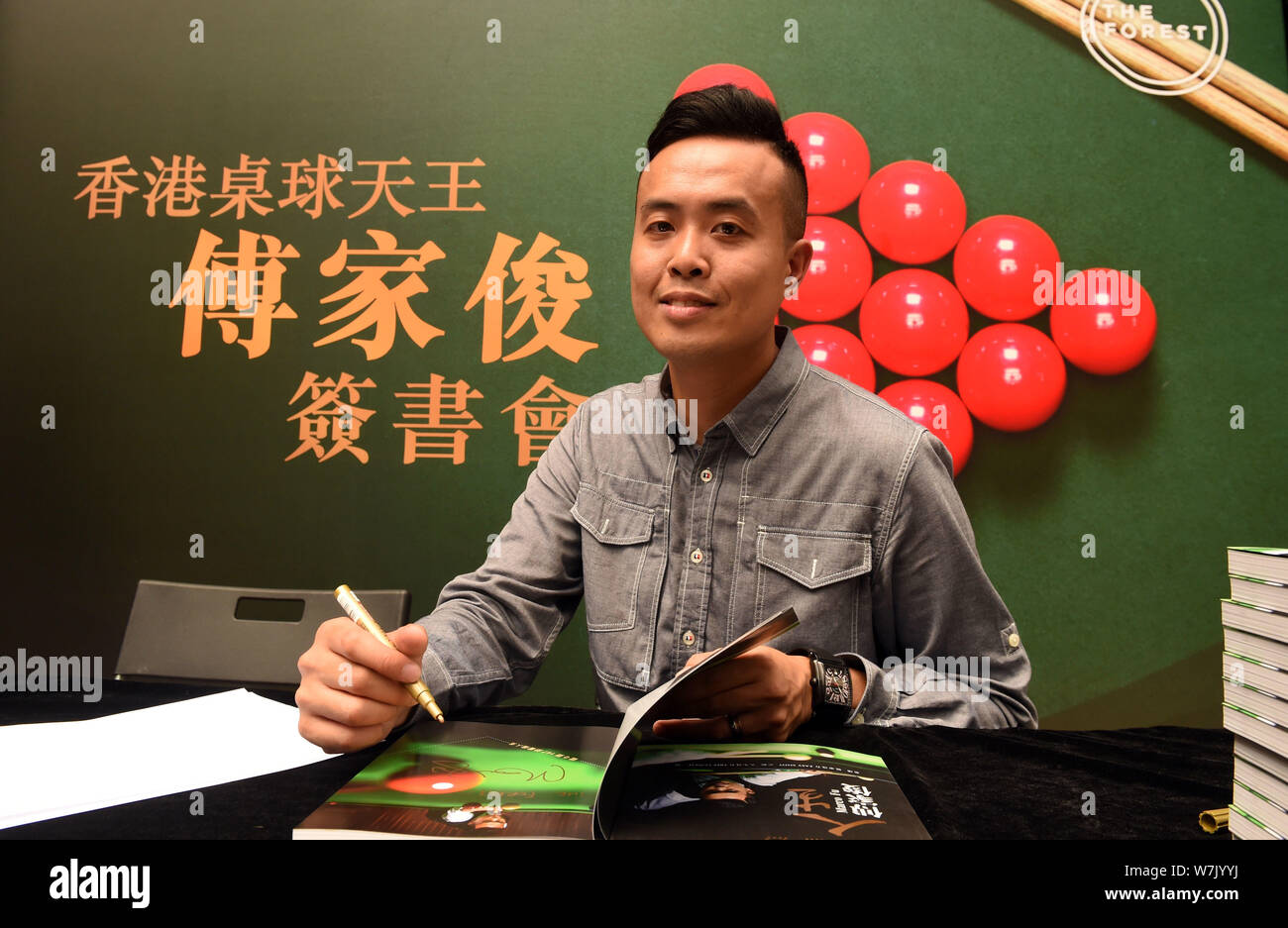 Hong Kong snooker player Marco Fu attends a signing event for his ...