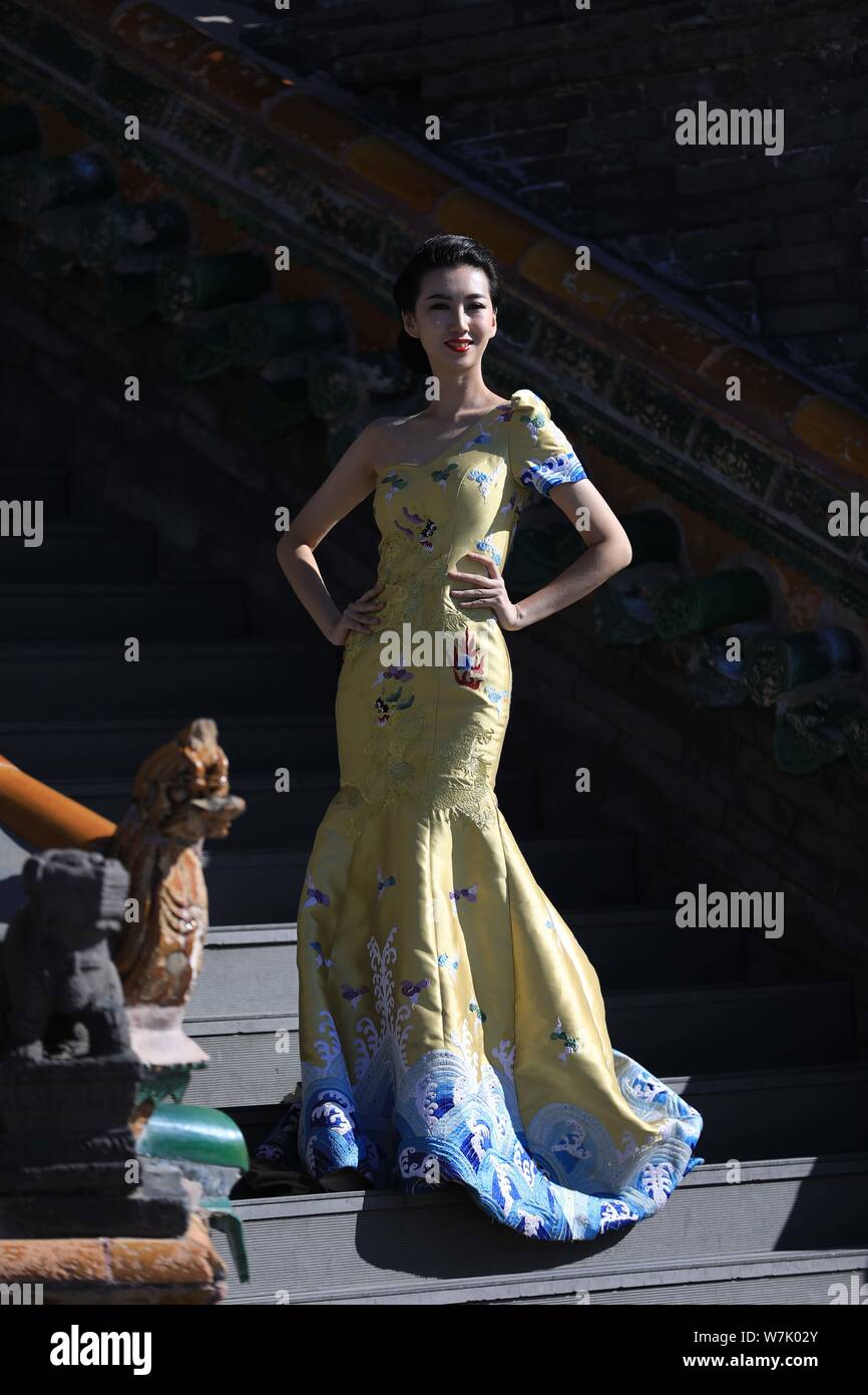 A model displays cheongsam, also known as qipao in Chinese, during the ...