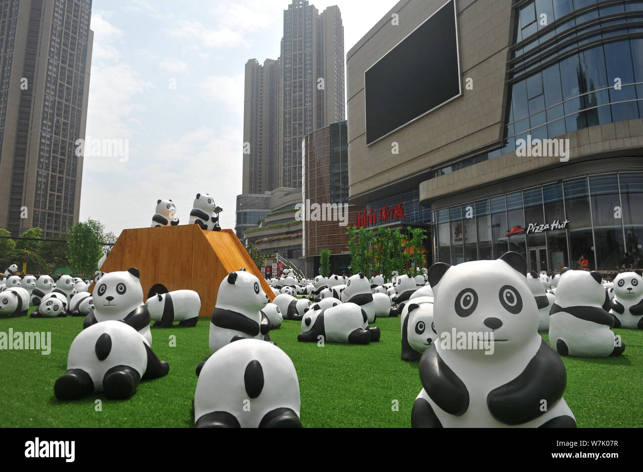 Giant panda sculptures are on display in front of the UniPark shopping ...