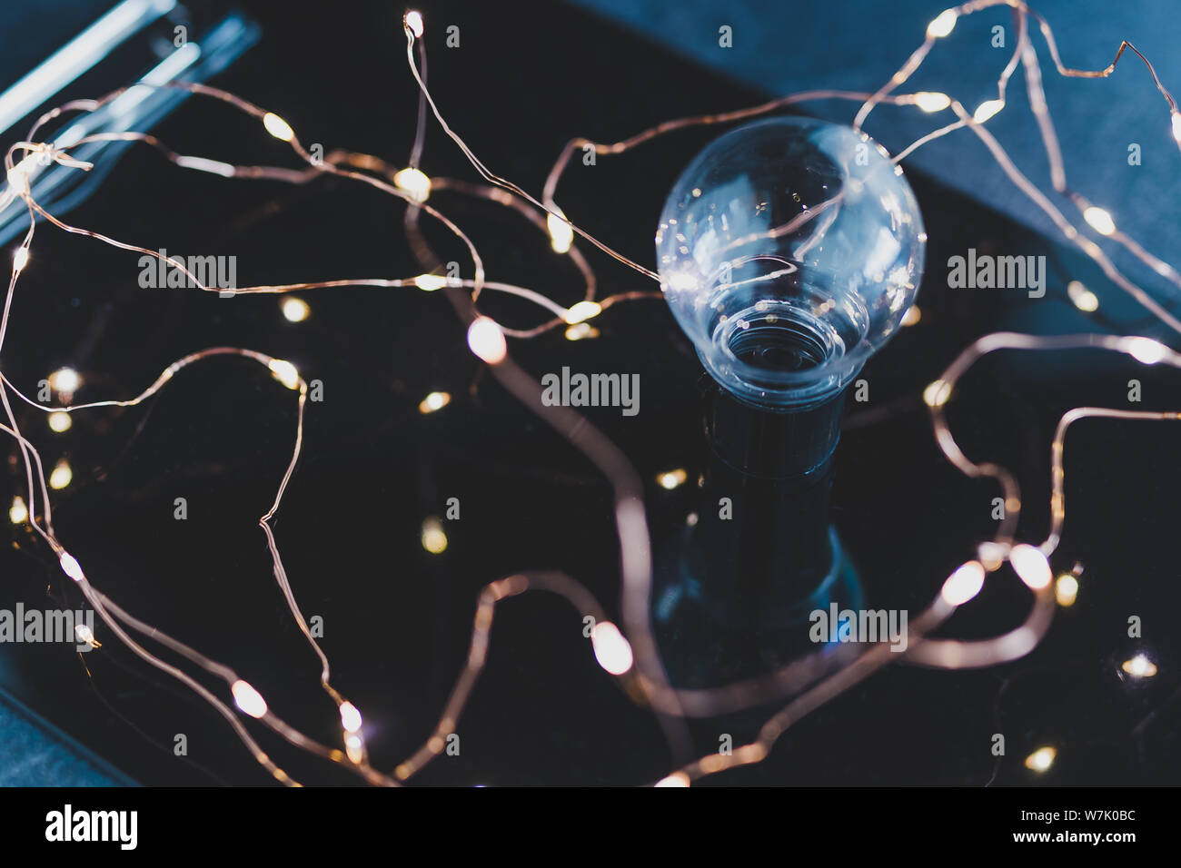 light bulb on clipboard surrounded by string lights, concept of new ...