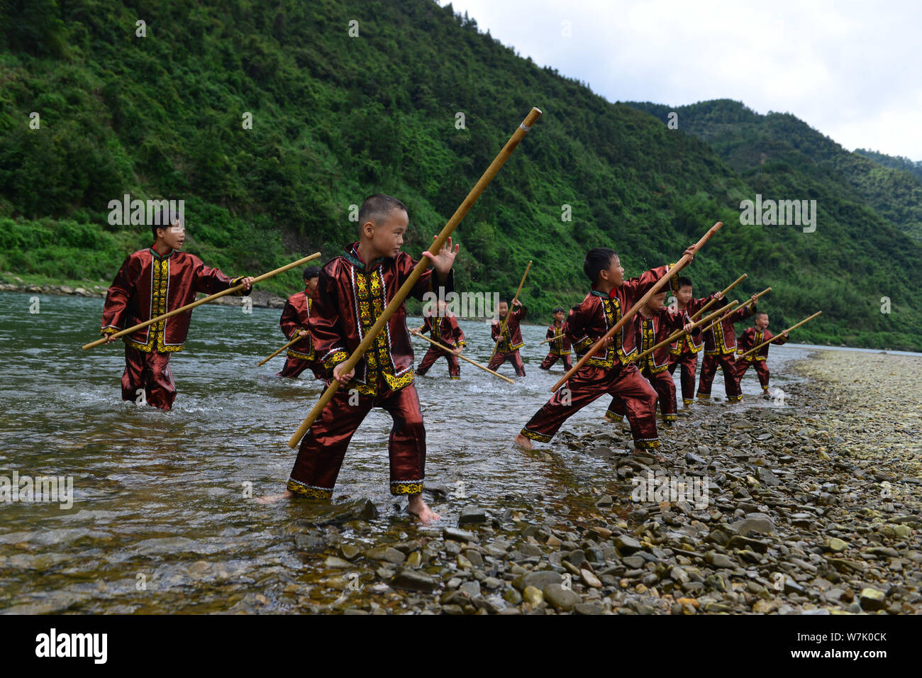 Chinese children of Miao ethnic group wearing traditional costumes ...