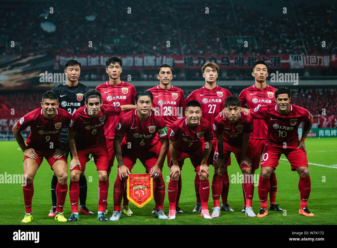 Players of the starting line-up of China's Shanghai SIPG pose before ...