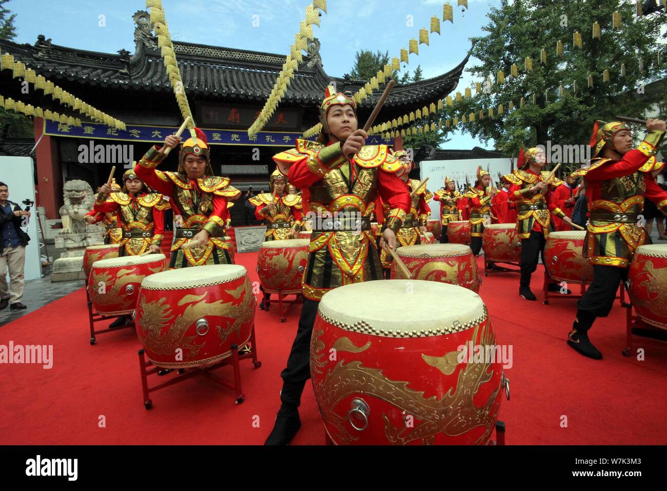 Participants dressed in traditional costumes perform a ritual to mark ...