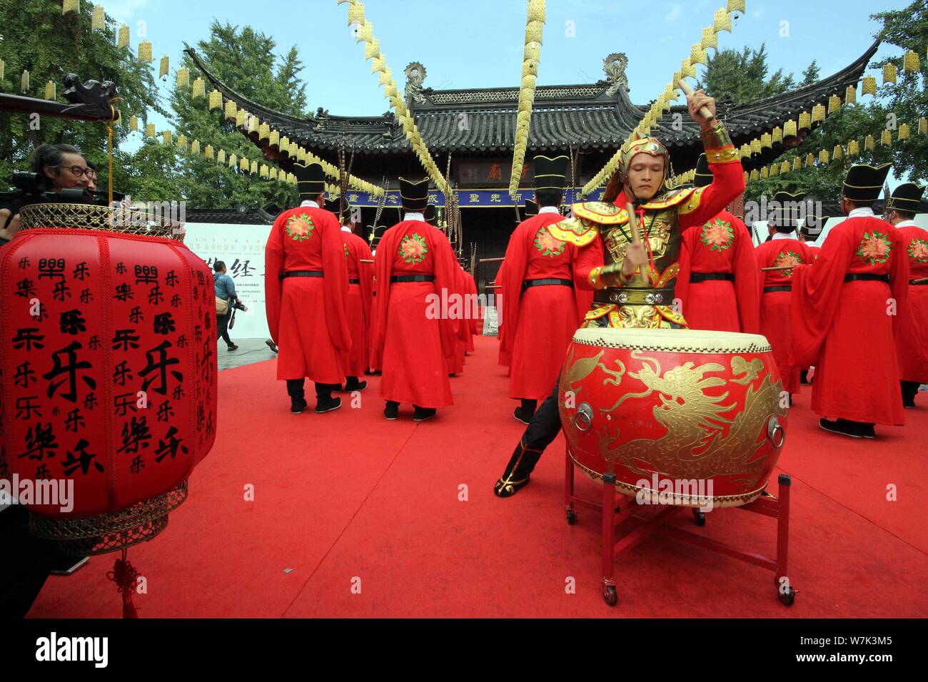 Participants dressed in traditional costumes perform a ritual to mark ...
