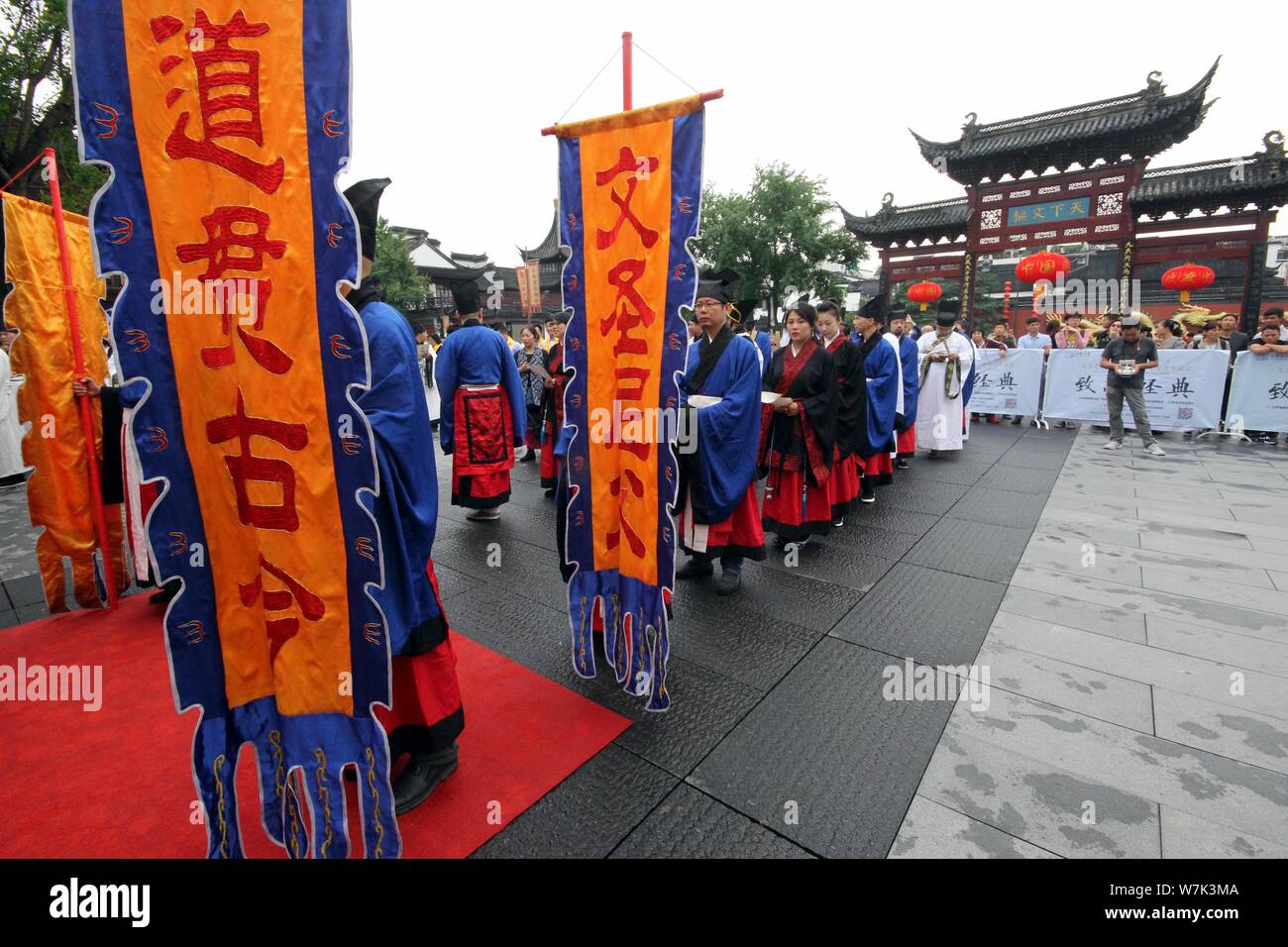Participants dressed in traditional costumes perform a ritual to mark ...