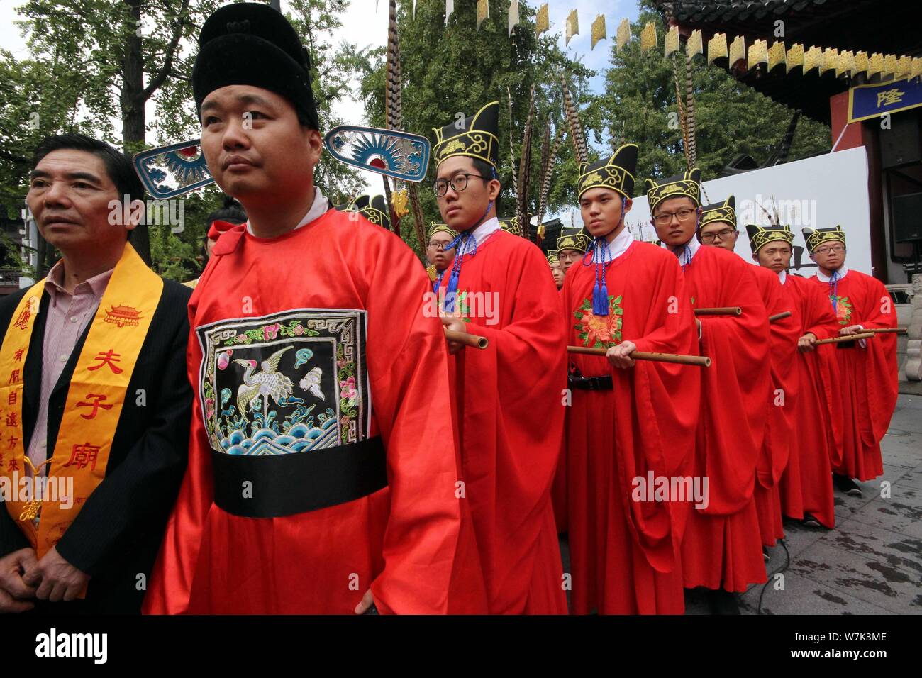 Participants dressed in traditional costumes perform a ritual to mark ...