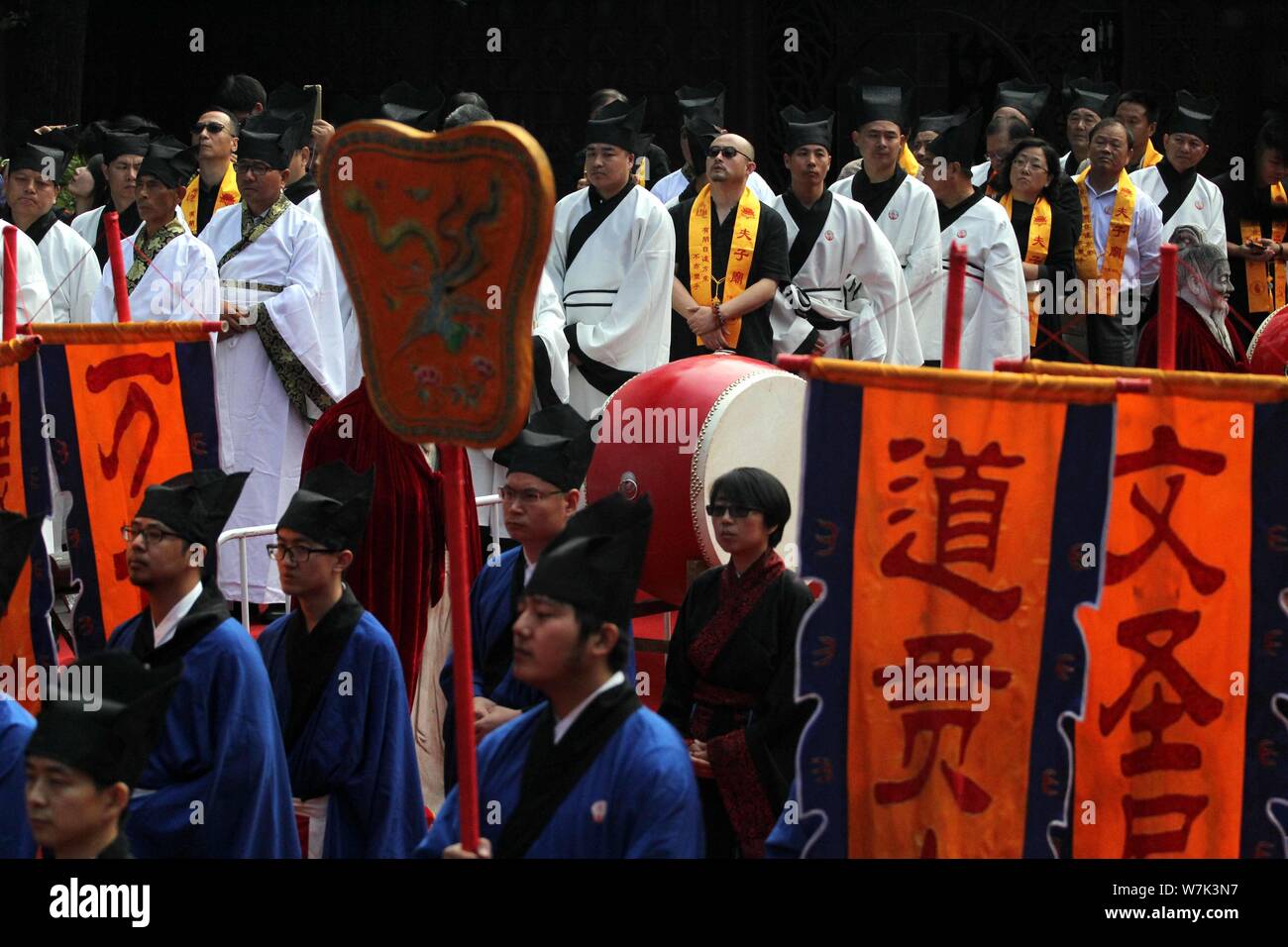 Participants dressed in traditional costumes perform a ritual to mark ...