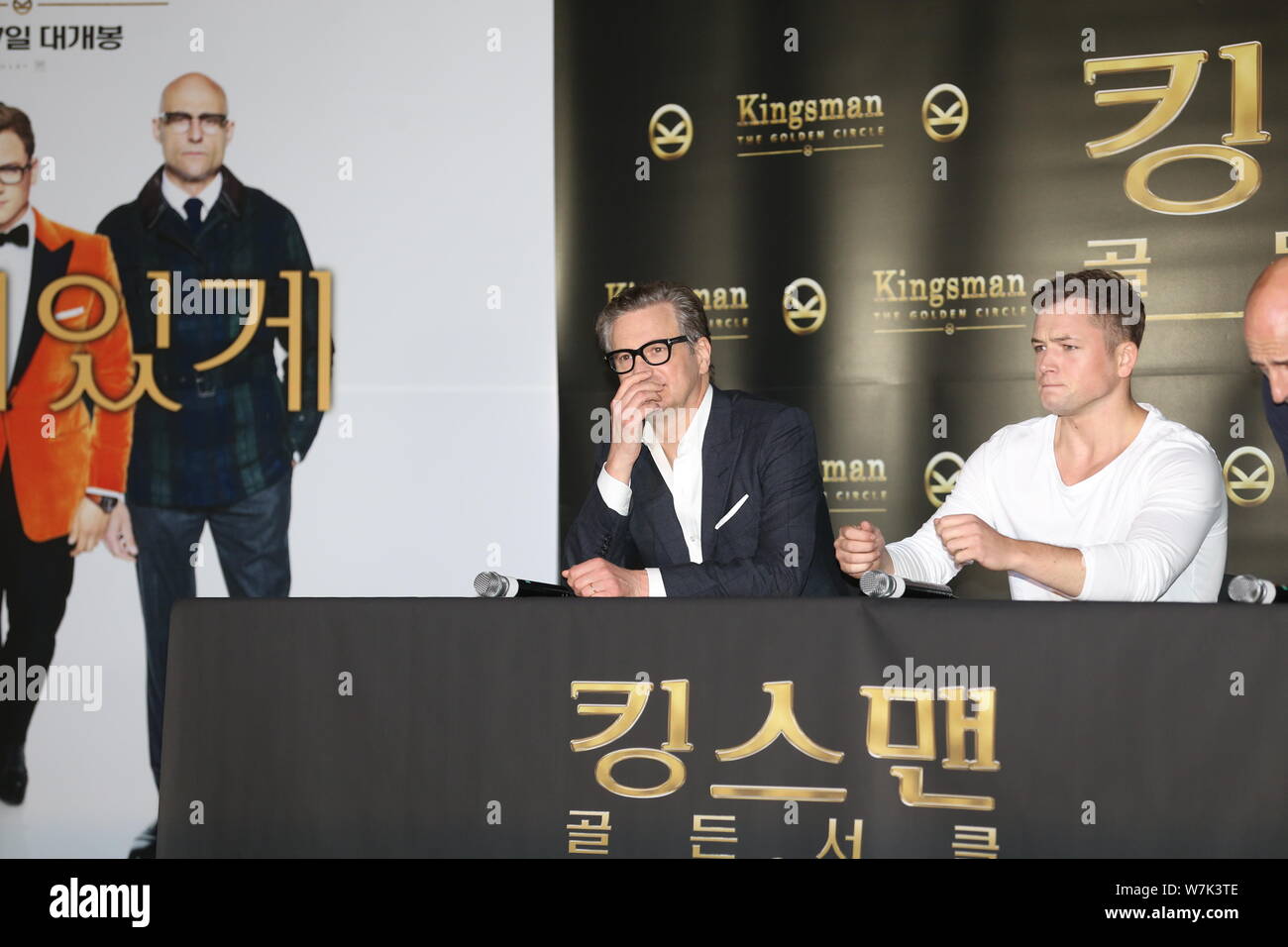 British actors Colin Firth, left, and Taron Egerton attend a press ...