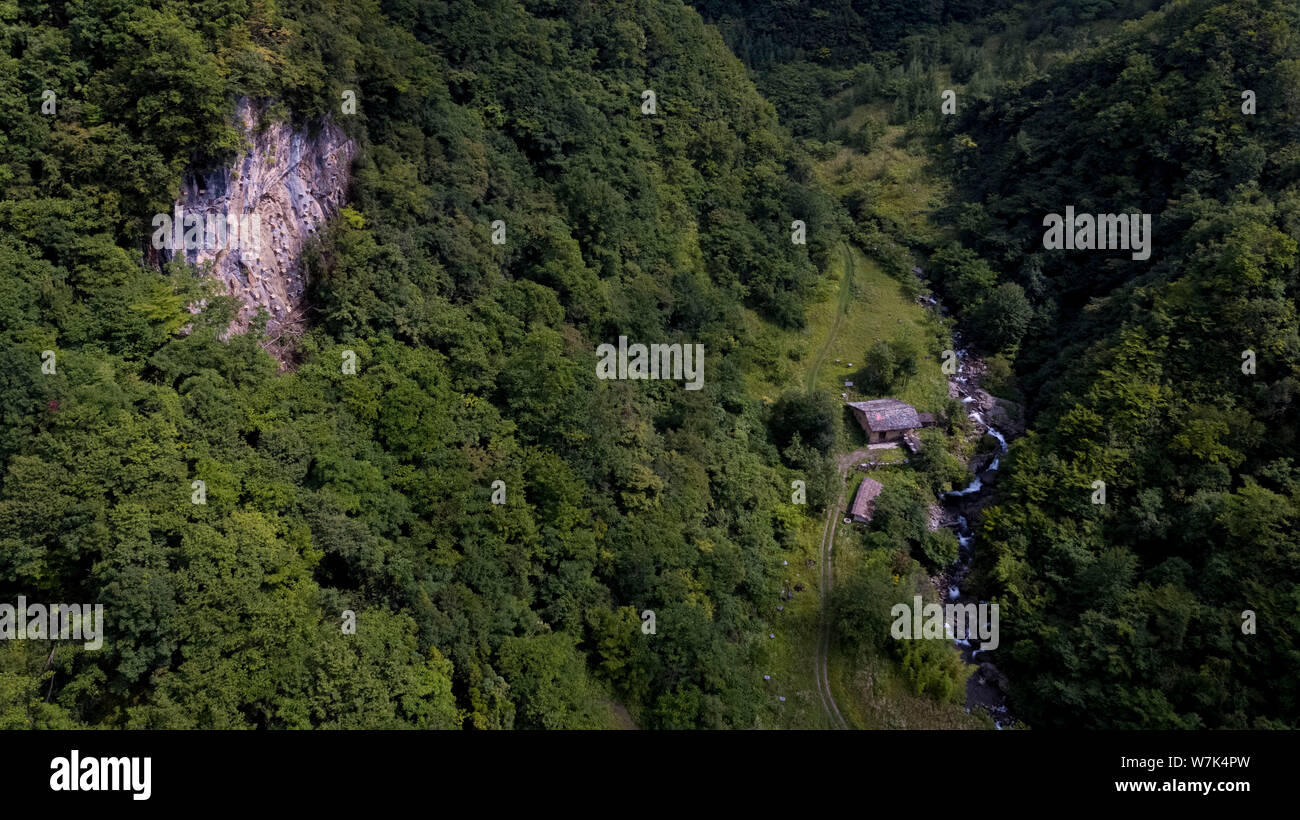 --FILE--Wooden hives hang on a steep cliff of a mountain in Zhenping ...