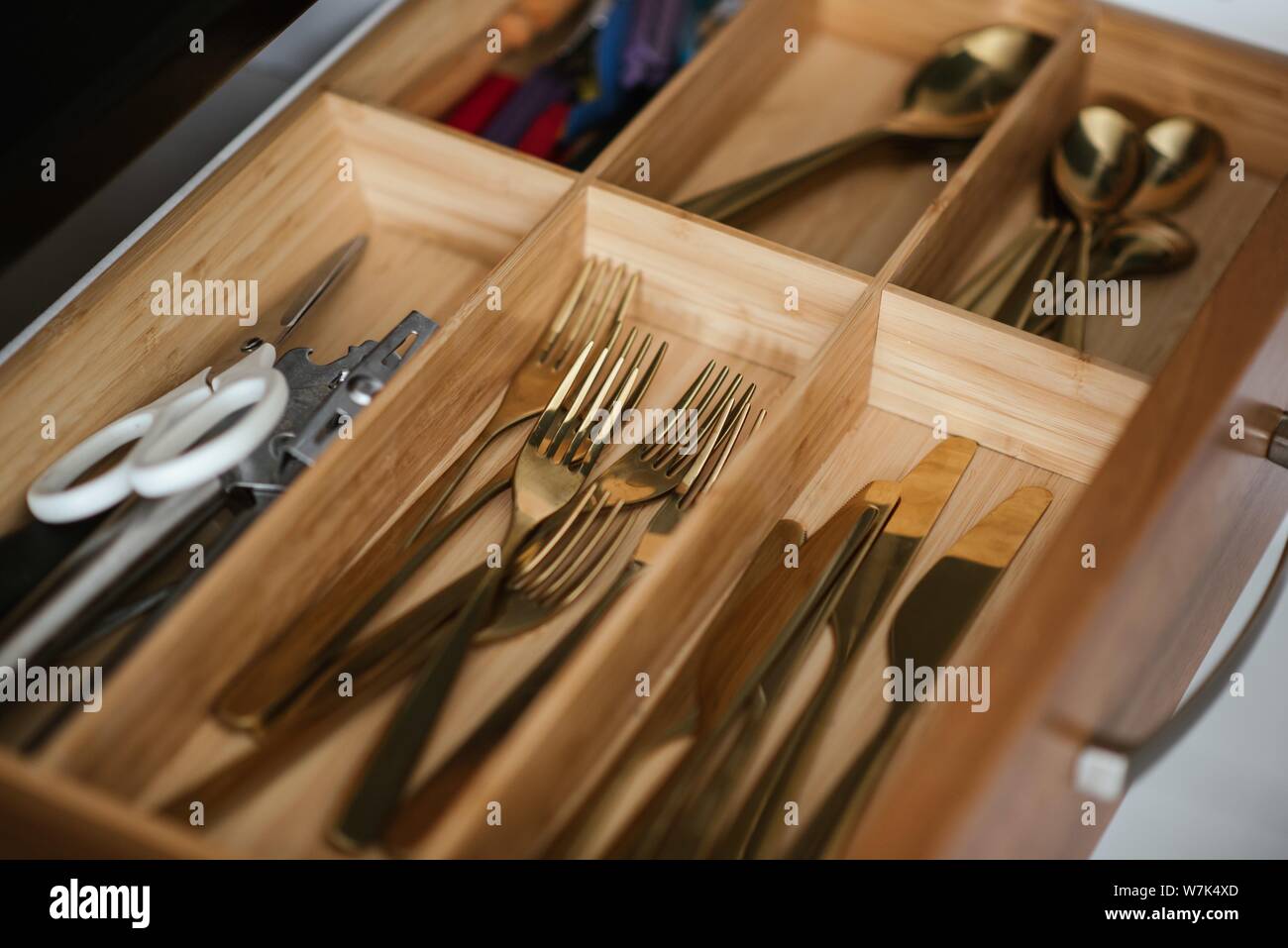 Closeup shot of a drawer with different kinds of silverware with ...