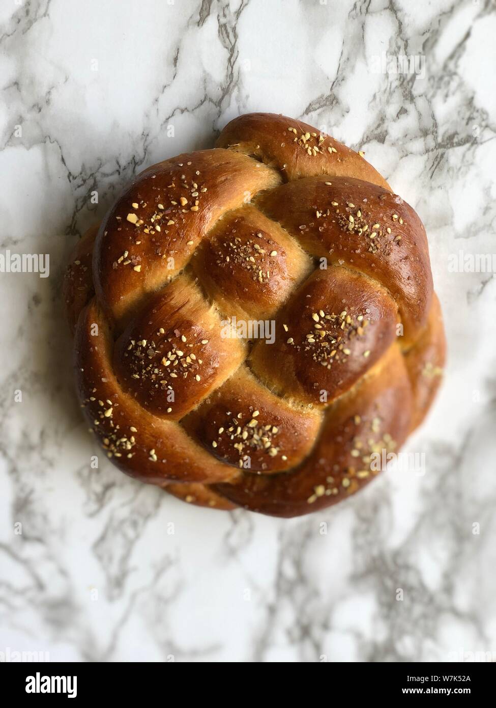 Round challah braided bread on marble background homemade baked ...