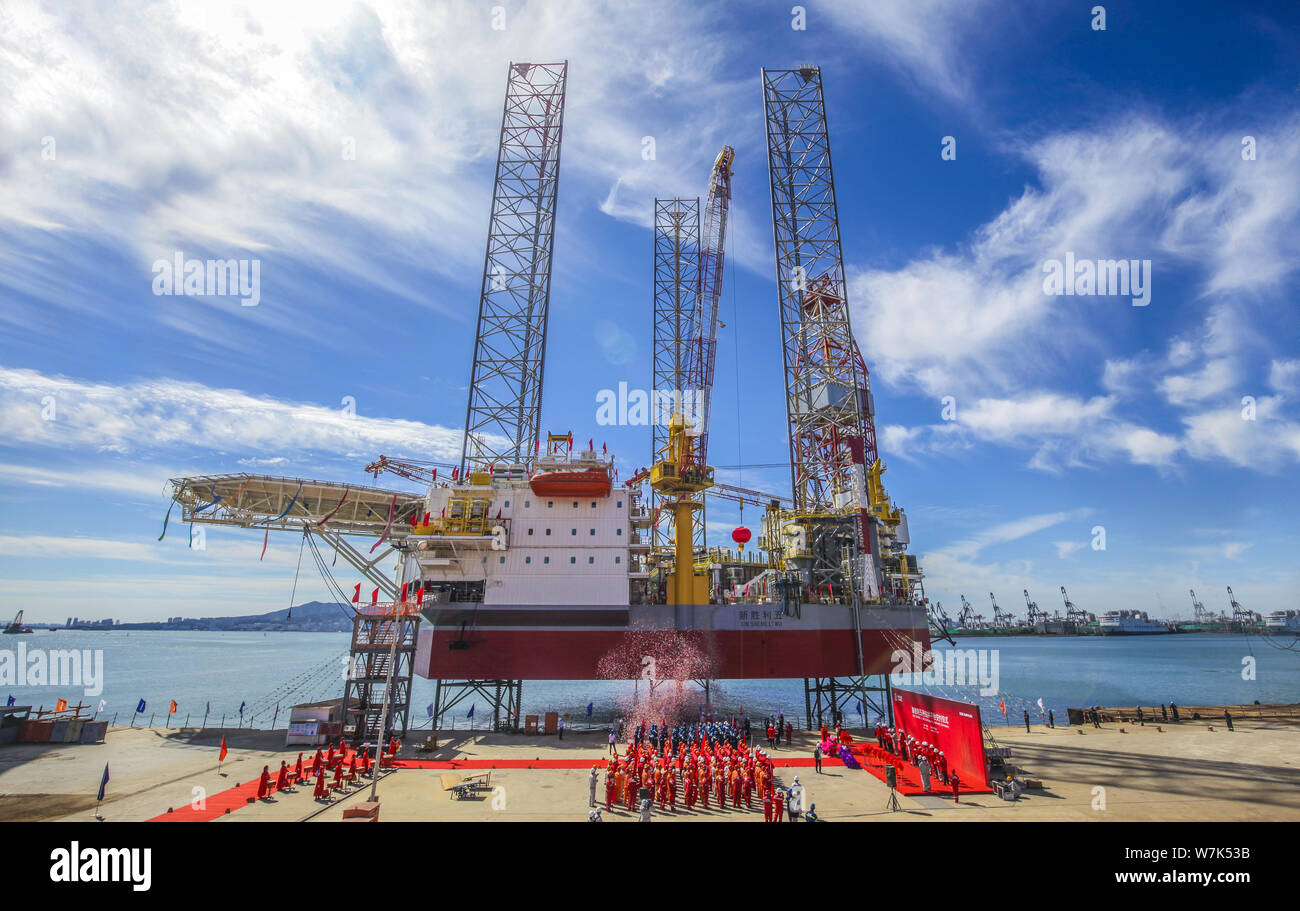 Chinese workers attend the delivery ceremony of the ''Xin Shengli Wu ...