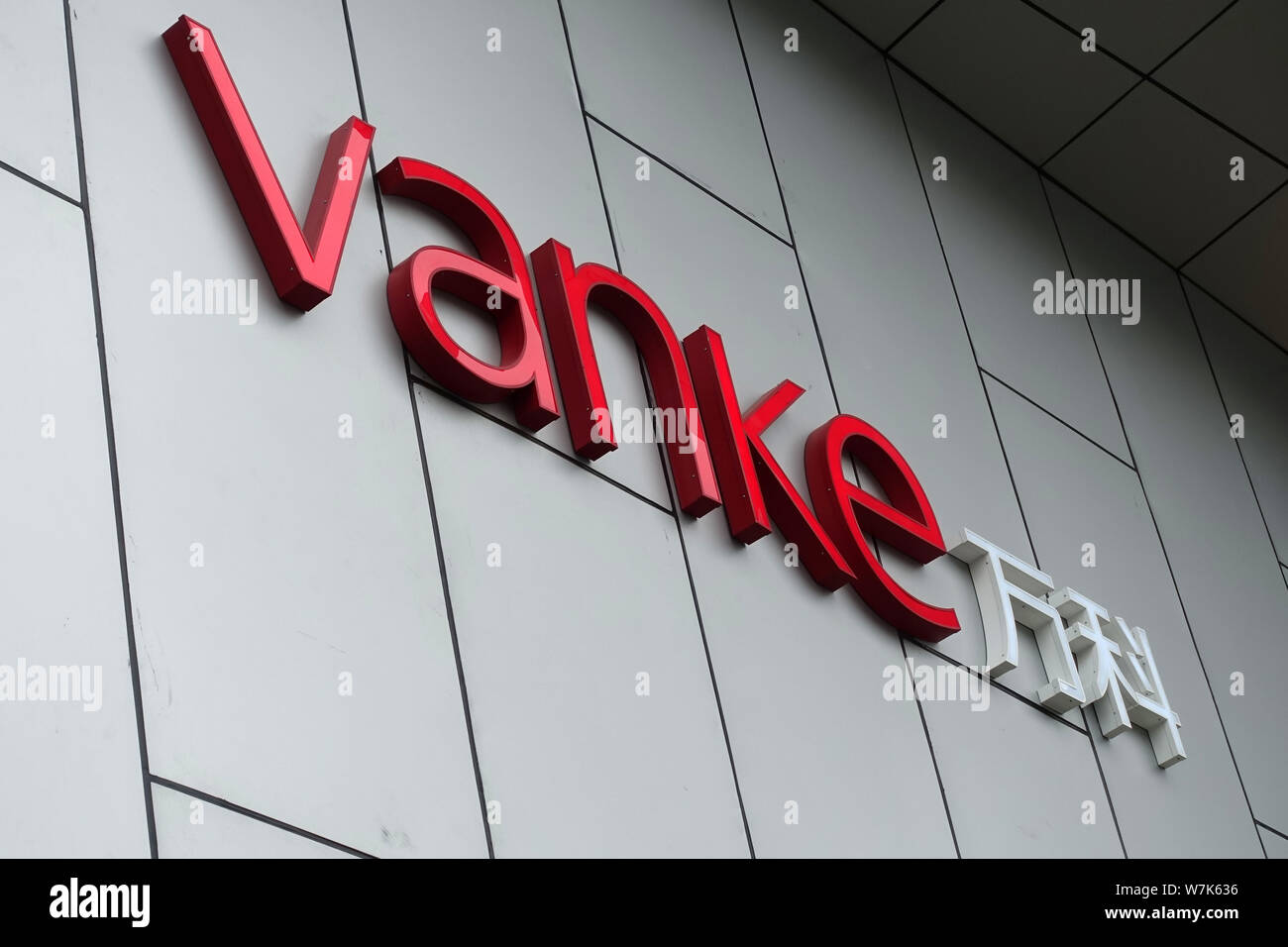 --FILE--A logo of Vanke is seen on a building at a residential quarter ...