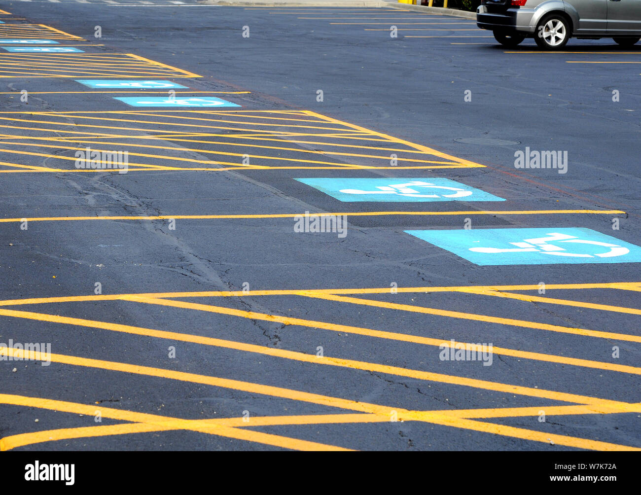 new disability parking lot on morning time Stock Photo - Alamy