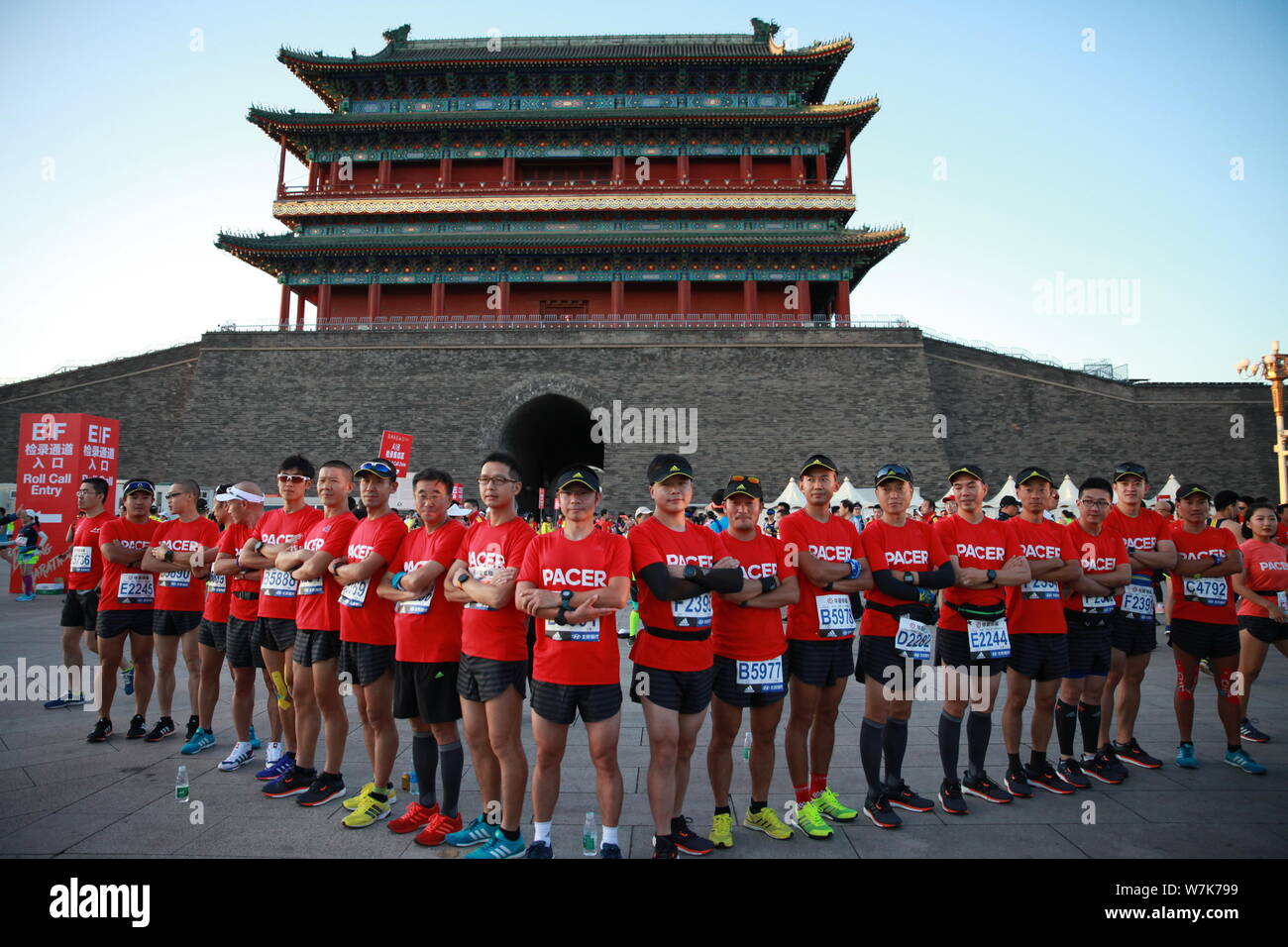 Runners pose for photos before the 2017 CFLD Beijing Marathon from ...