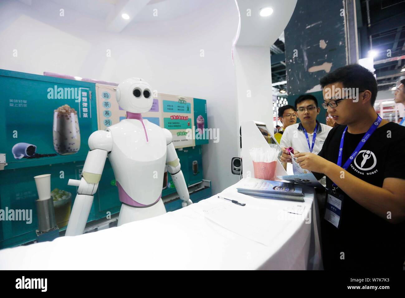 A robot works at a tea shop during the Shanghai International Unmanned ...