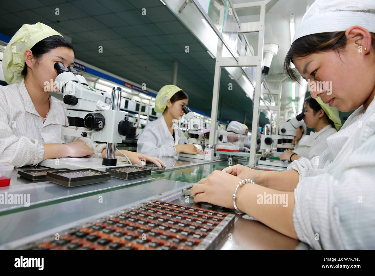 Female workers in manufacturing line hi-res stock photography and ...