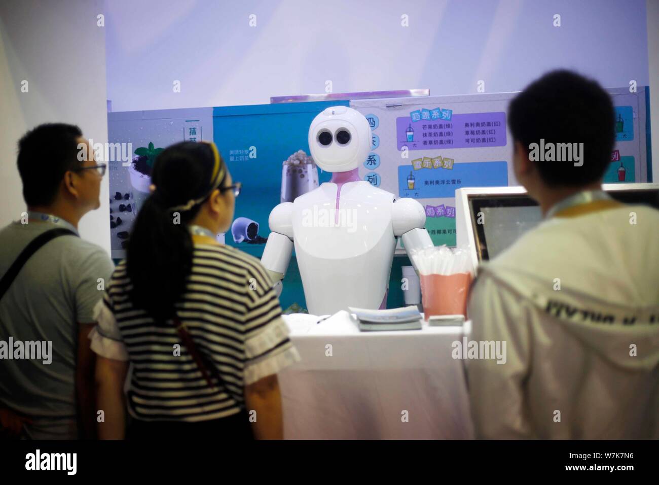 A robot works at a tea shop during the Shanghai International Unmanned ...