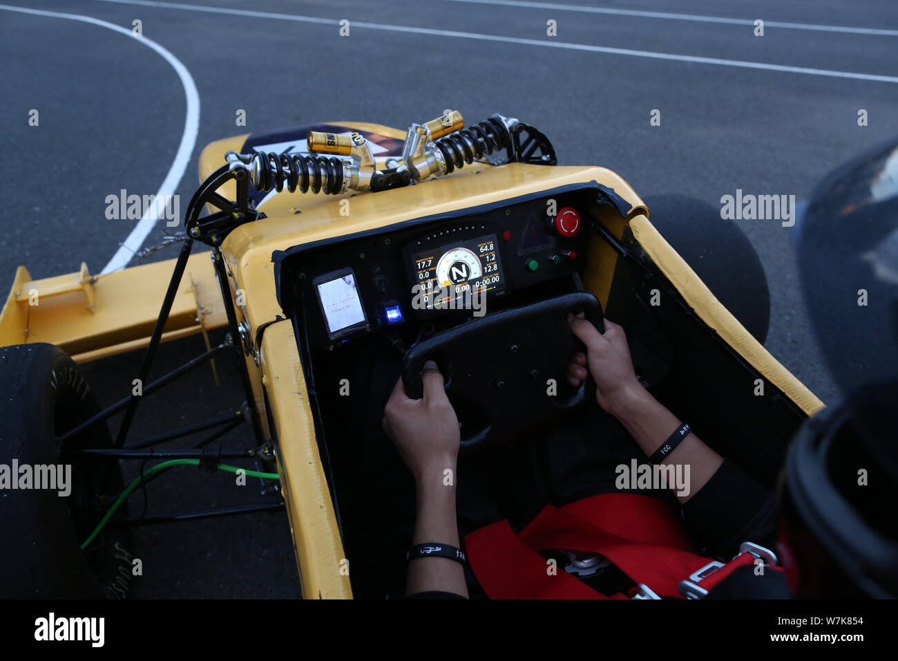 A student drives the new Formula One racing car assembled by three ...