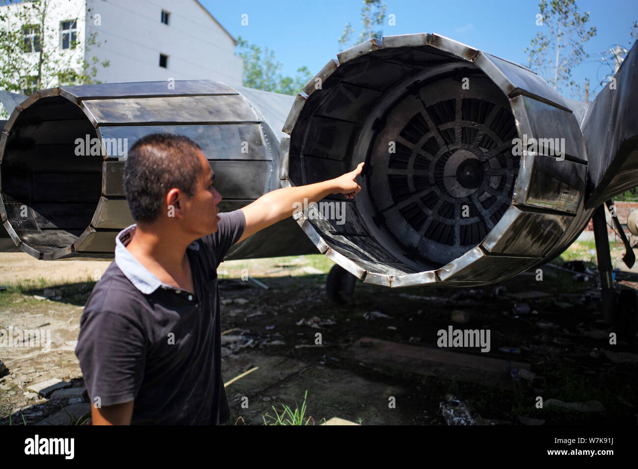 Chinese model airplane hobbyist Gu Chunlin shows the life-size model of ...