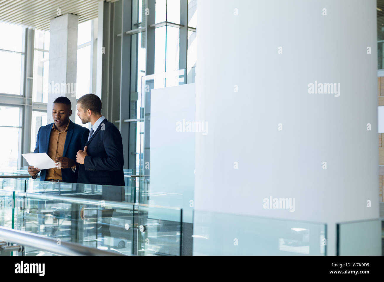 Two men stand talking hi-res stock photography and images - Alamy