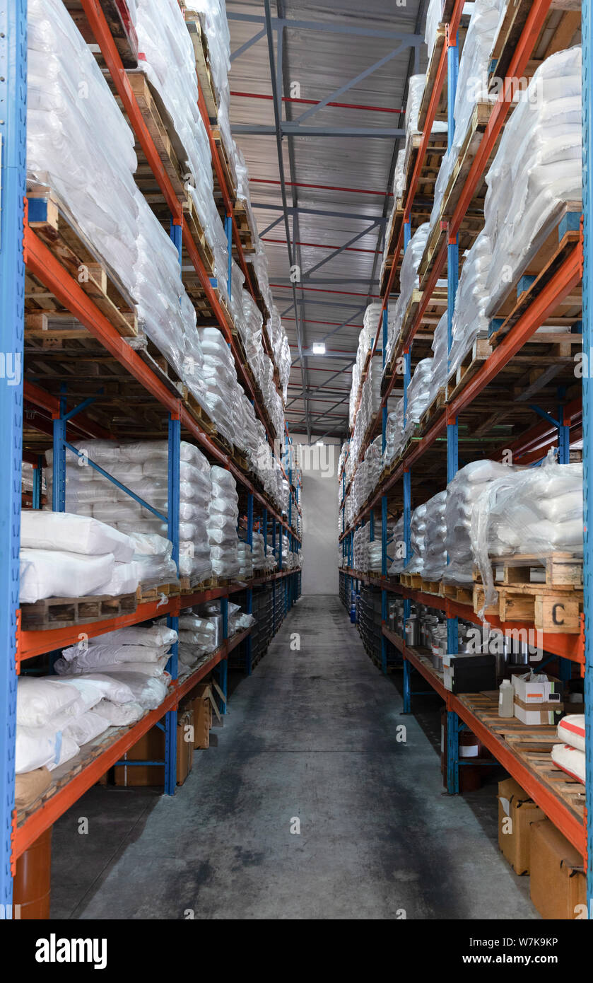 Goods and materials on a rack in warehouse Stock Photo - Alamy