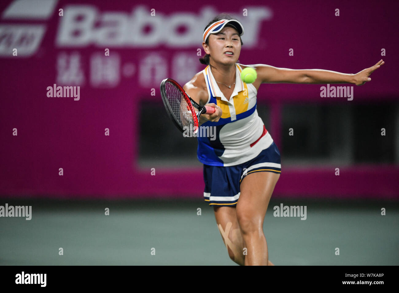 Peng Shuai of China returns a shot to Ons Jabeur of Tunisia in their ...