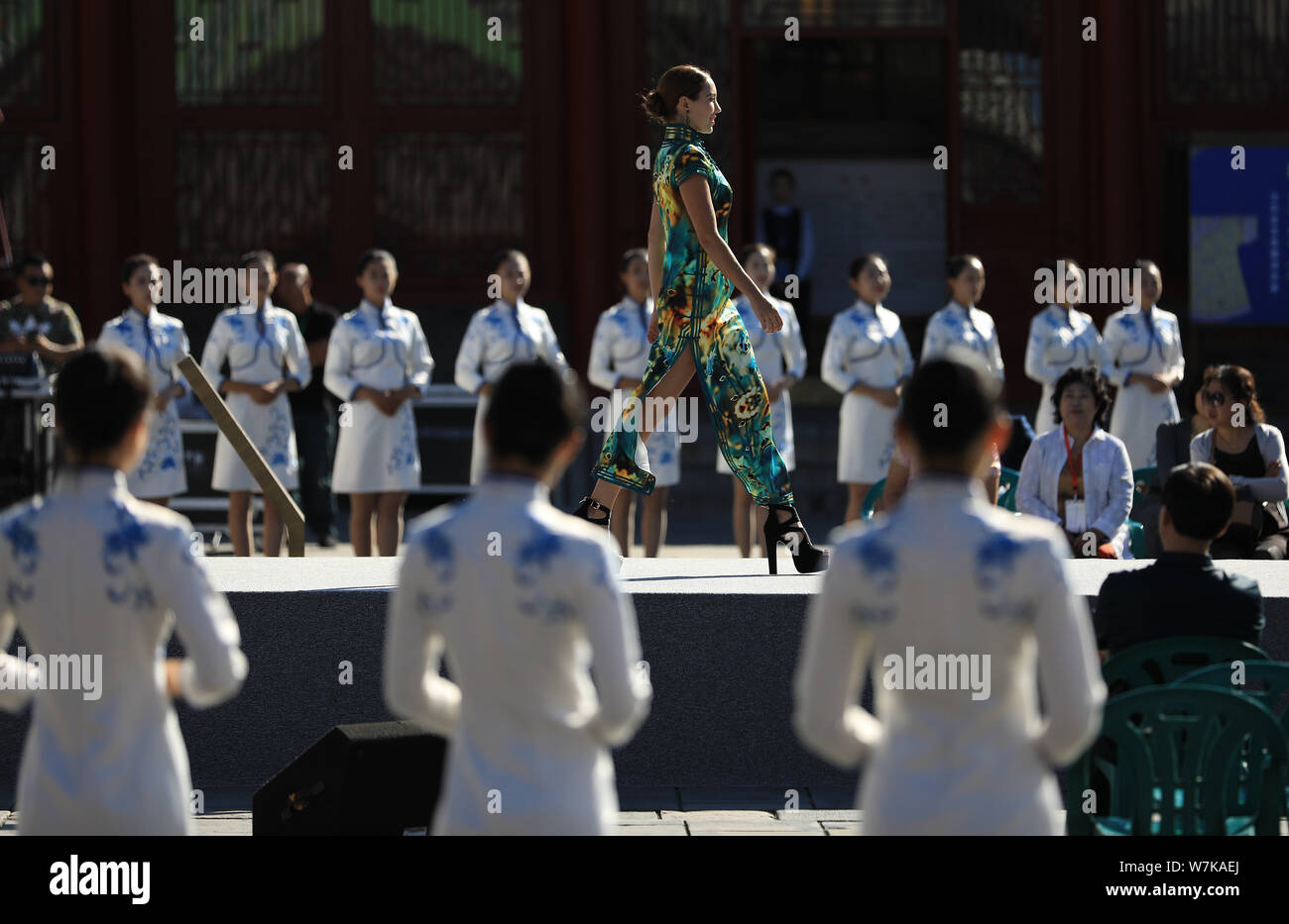 A model displays cheongsam, also known as qipao in Chinese, during the ...