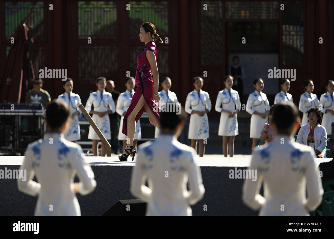 A model displays cheongsam, also known as qipao in Chinese, during the ...