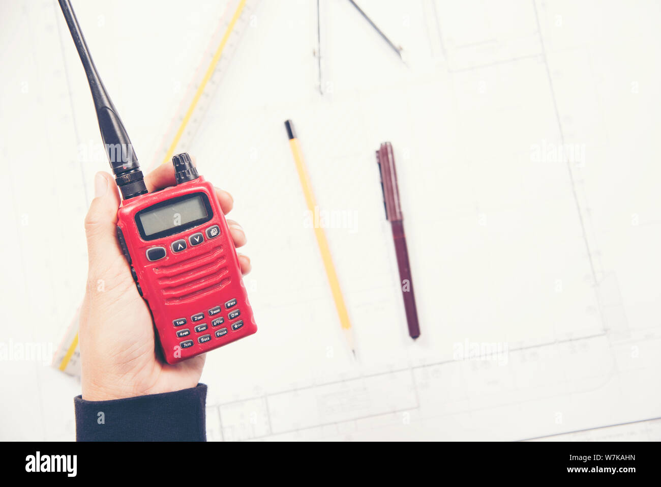 woman engineer hold radio in hand at construction site. working woman ...