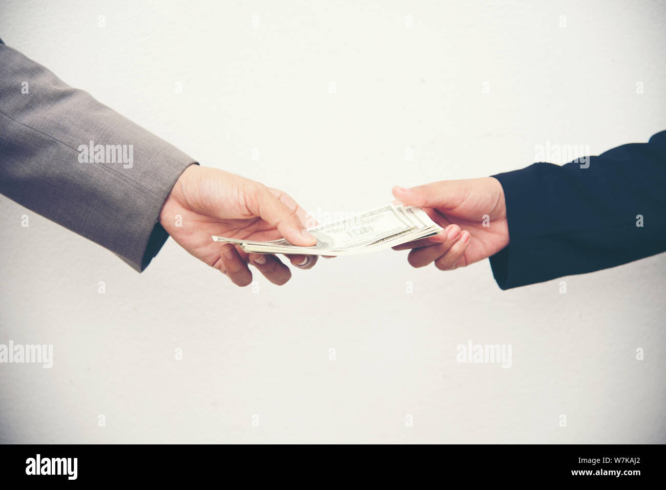 Businessman giving money to business woman. Corruption concept Stock ...