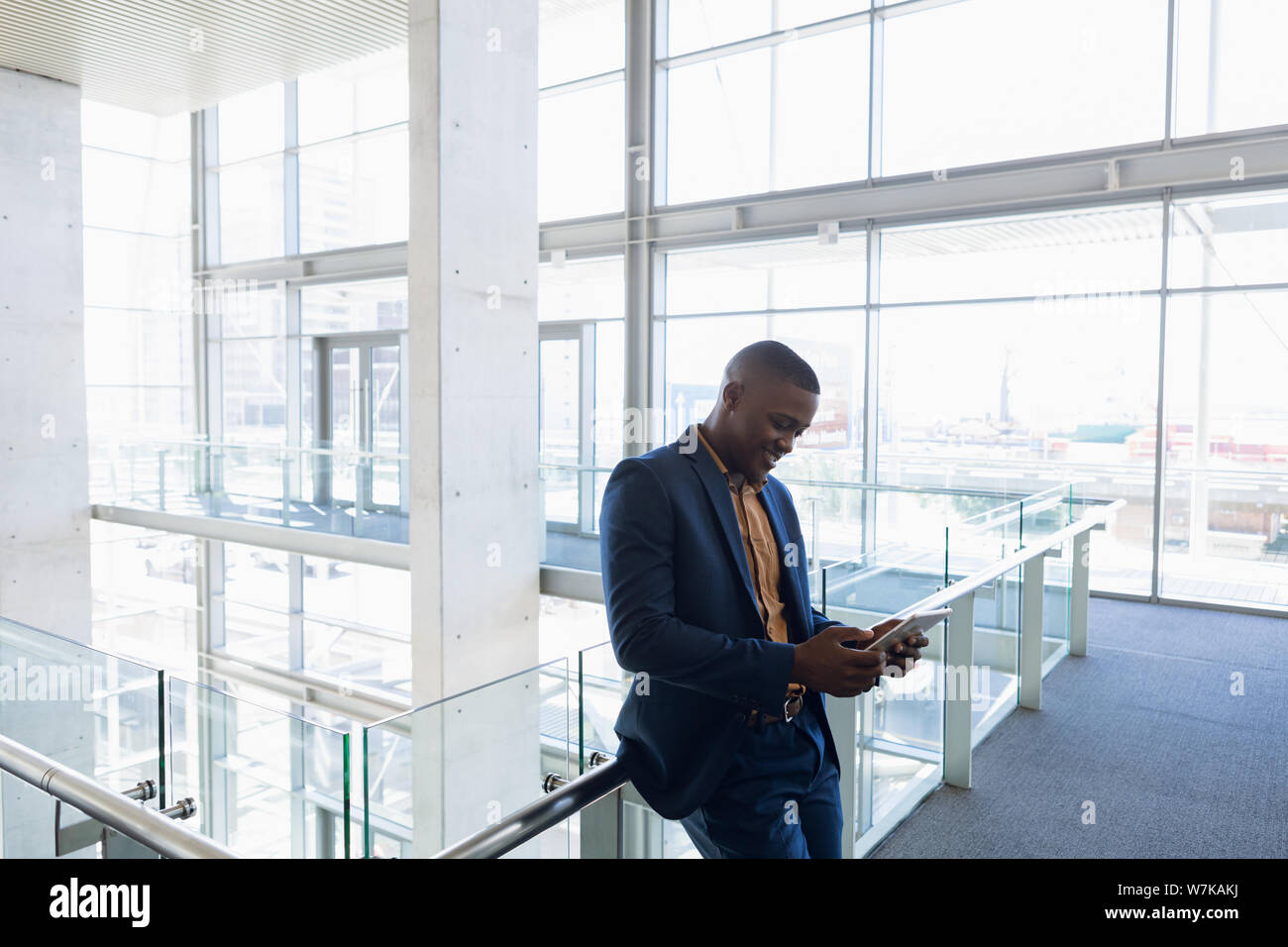 Businessman using tablet computer at work Stock Photo - Alamy