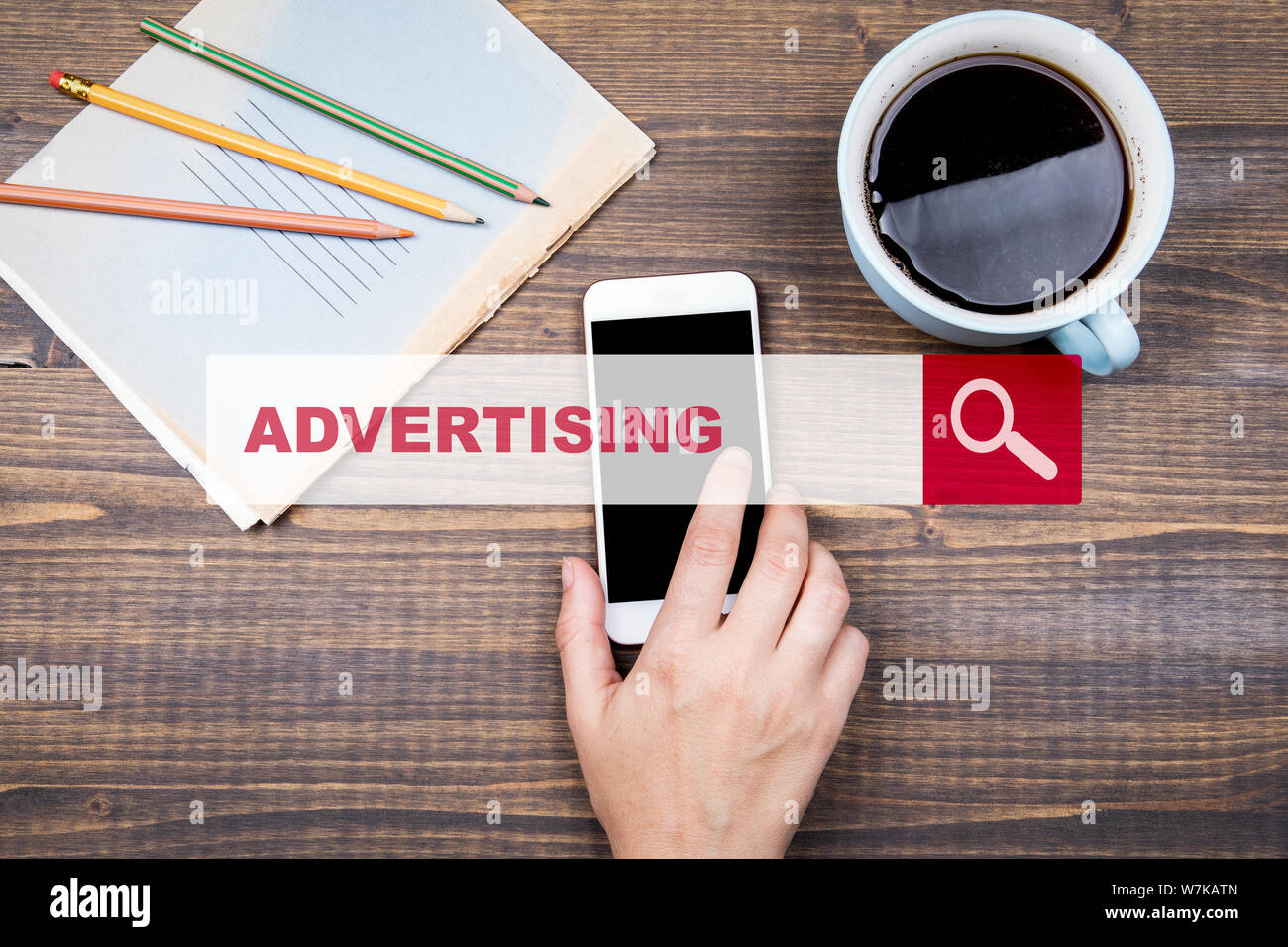 Advertising Concept. Hands holding phone Stock Photo - Alamy