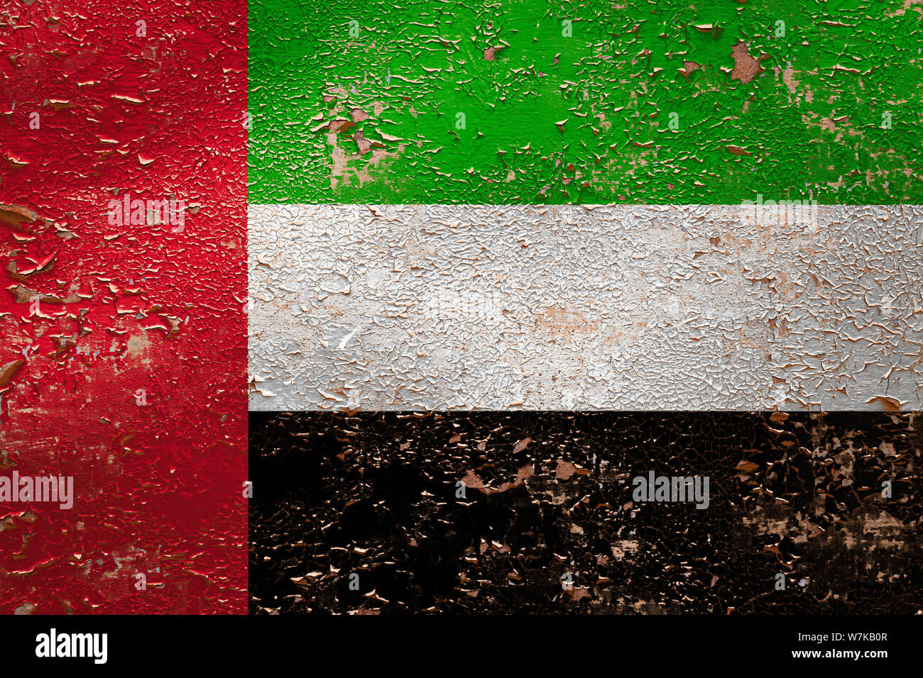 National flag of United Arab Emirates on old peeling wall background ...