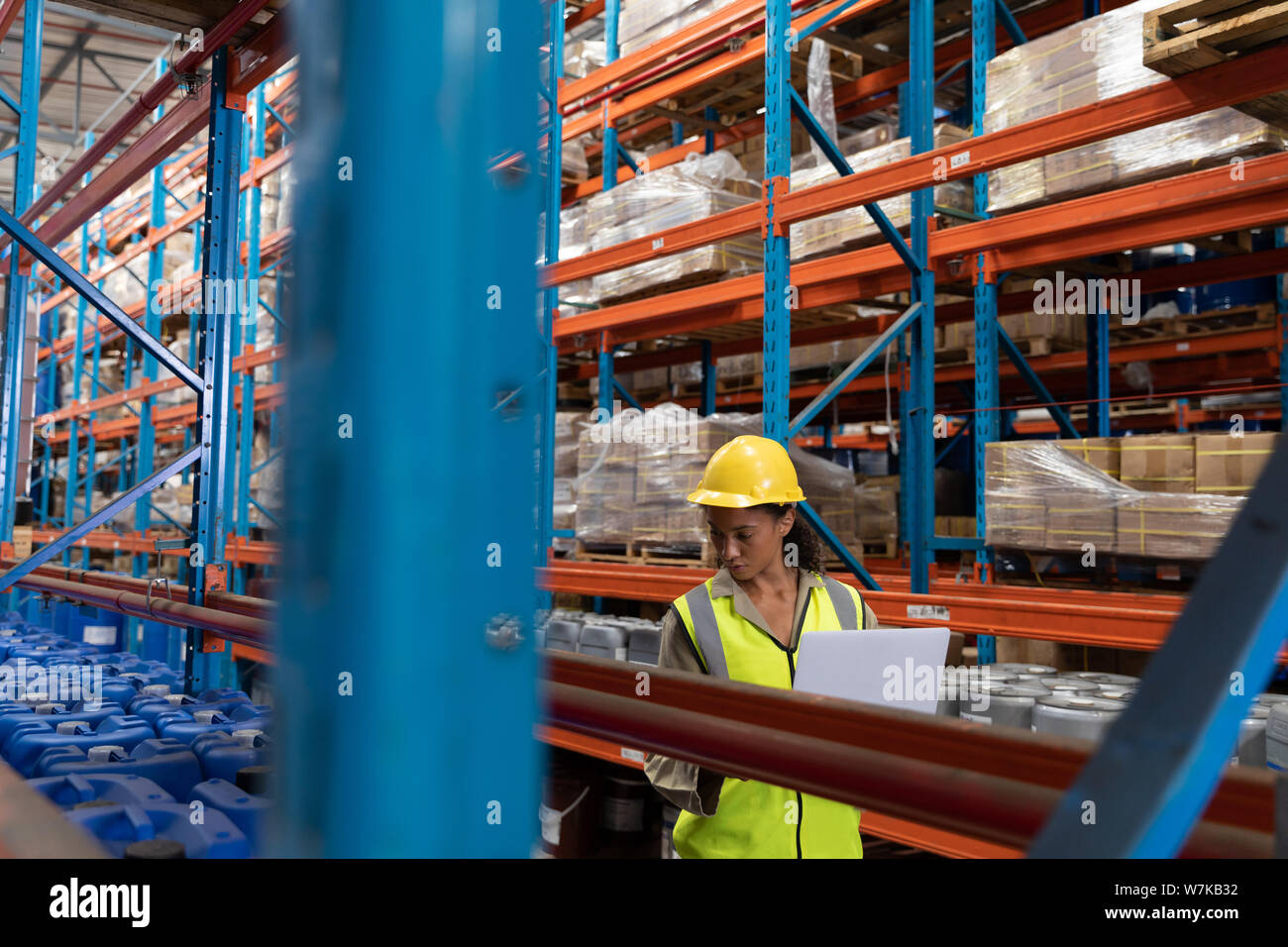 Female worker working in warehouse Stock Photo - Alamy