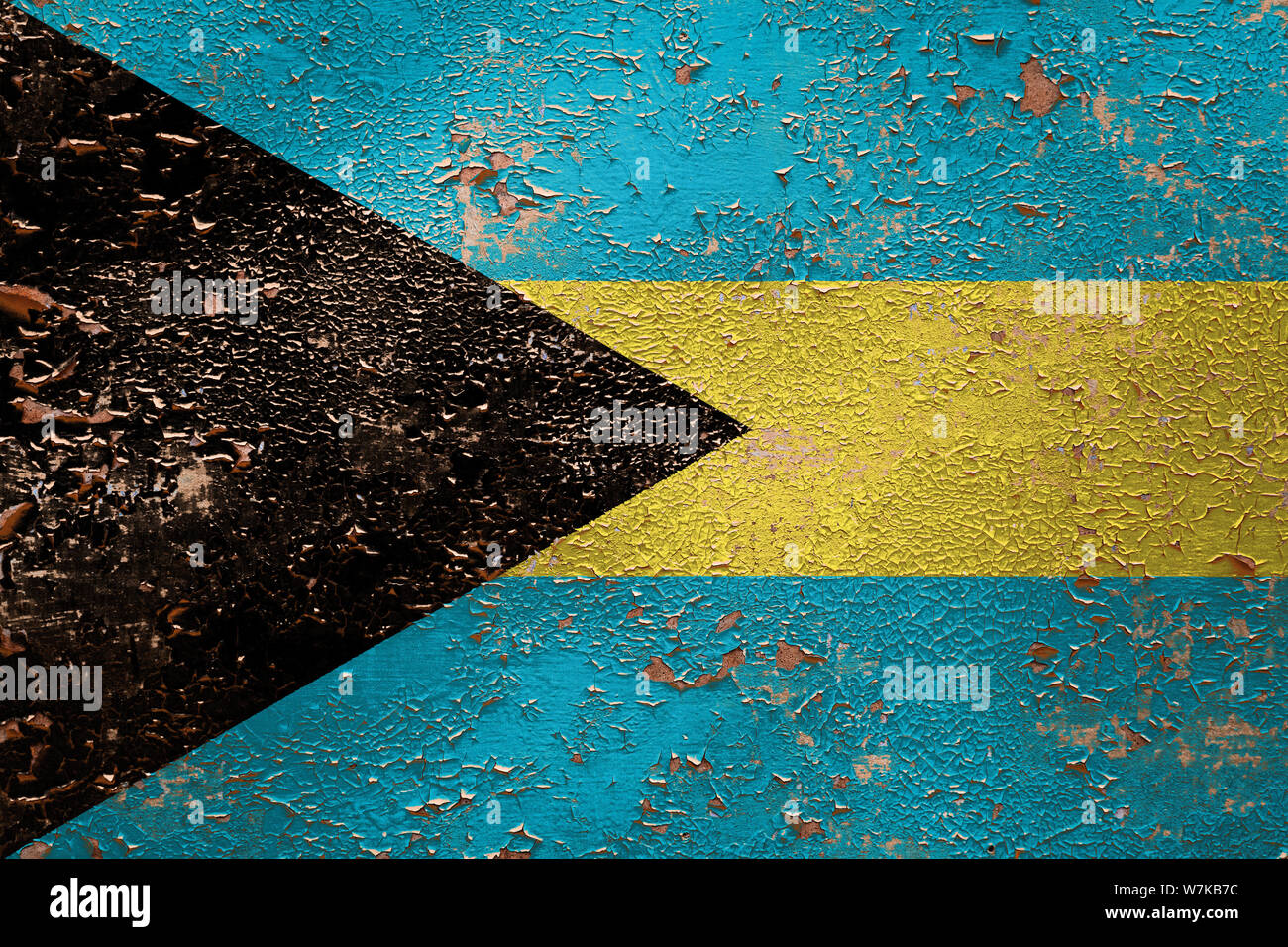 National flag of Bahamas on old peeling wall background.The concept of ...