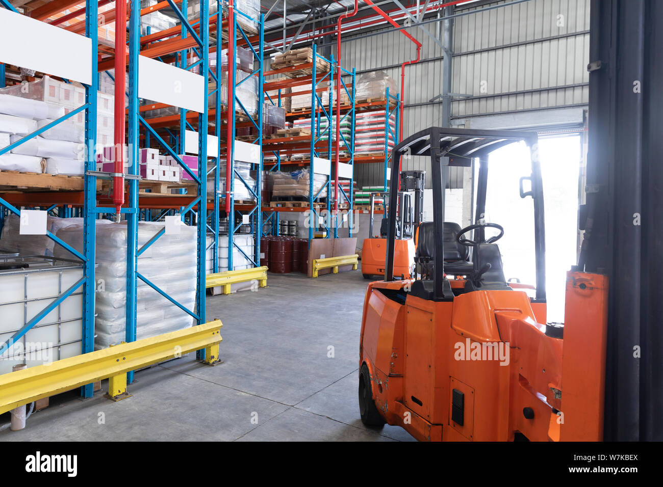 Goods and materials on a rack in warehouse Stock Photo - Alamy