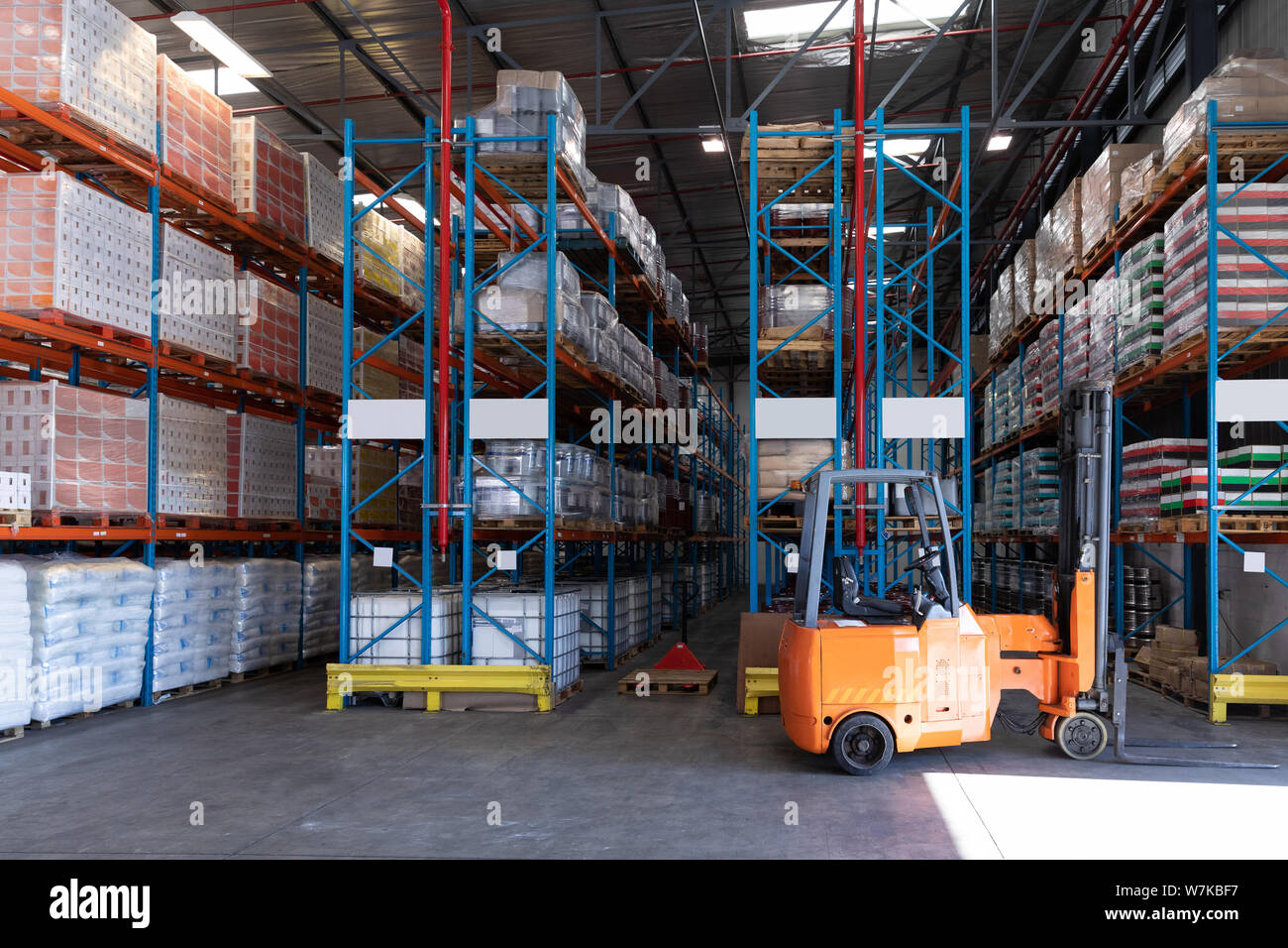 Goods and materials on a rack in warehouse Stock Photo - Alamy