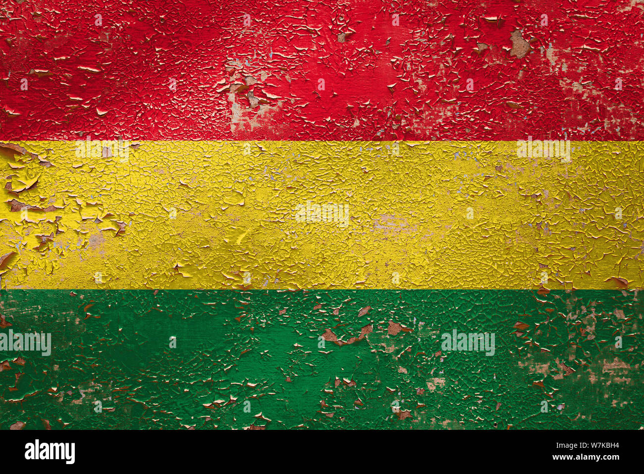 National flag of Bolivia on old peeling wall background.The concept of ...