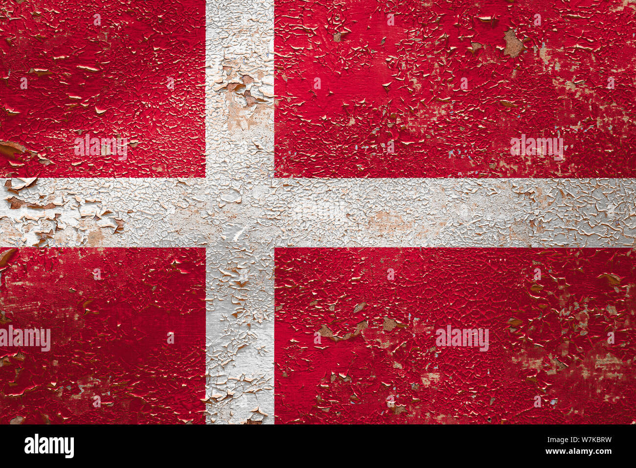 National flag of Denmark on old peeling wall background.The concept of ...