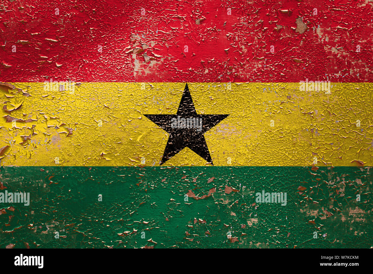 National flag of Ghana on old peeling wall background.The concept of ...