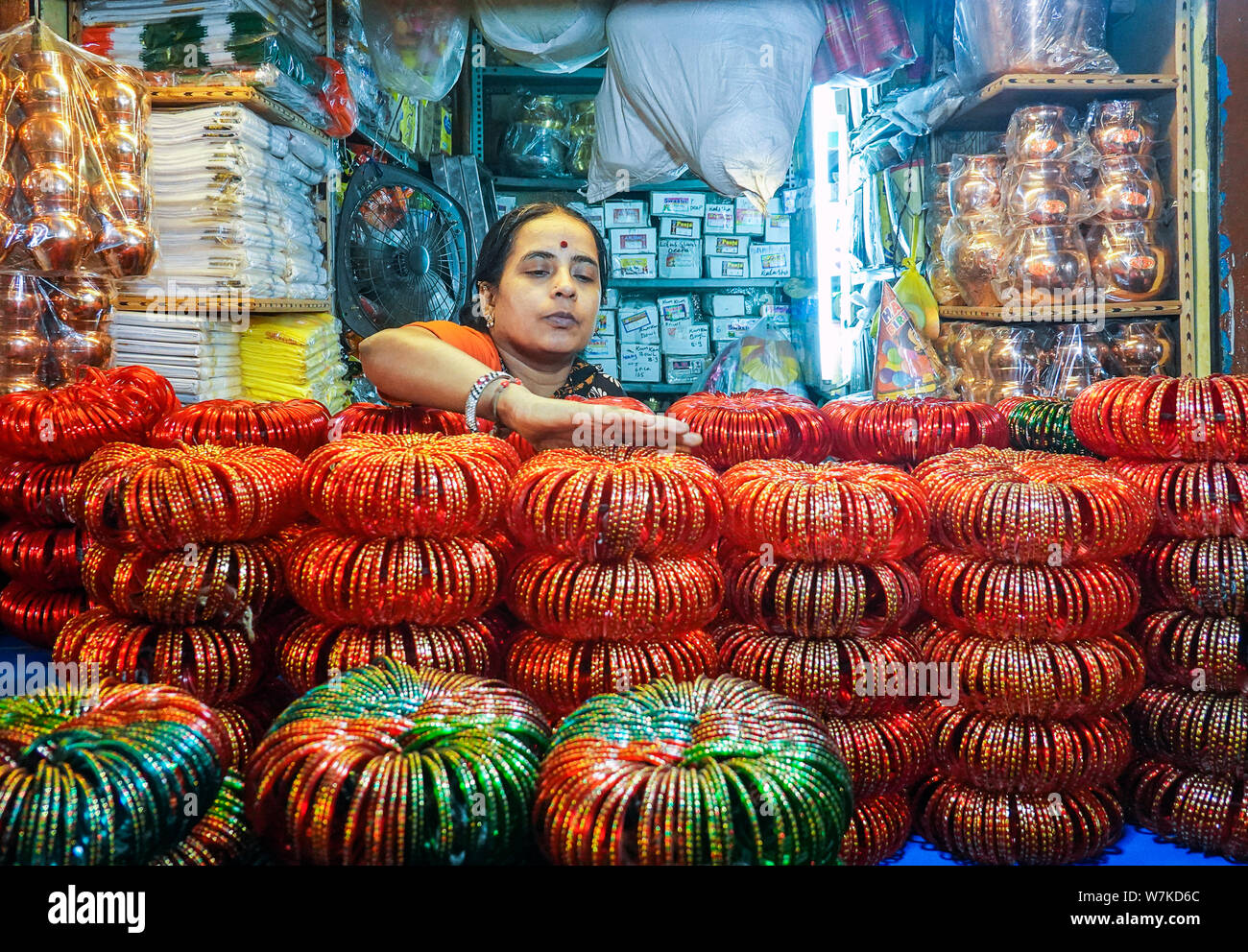 Indian woman selling bangles in a tiny shop at the basement of KR ...