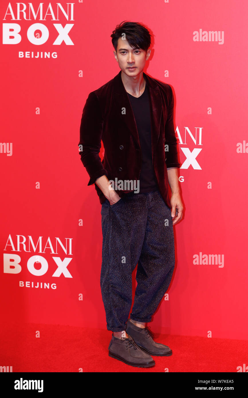Bruneian singer and actor Wu Chun poses as he arrives on the red carpet ...